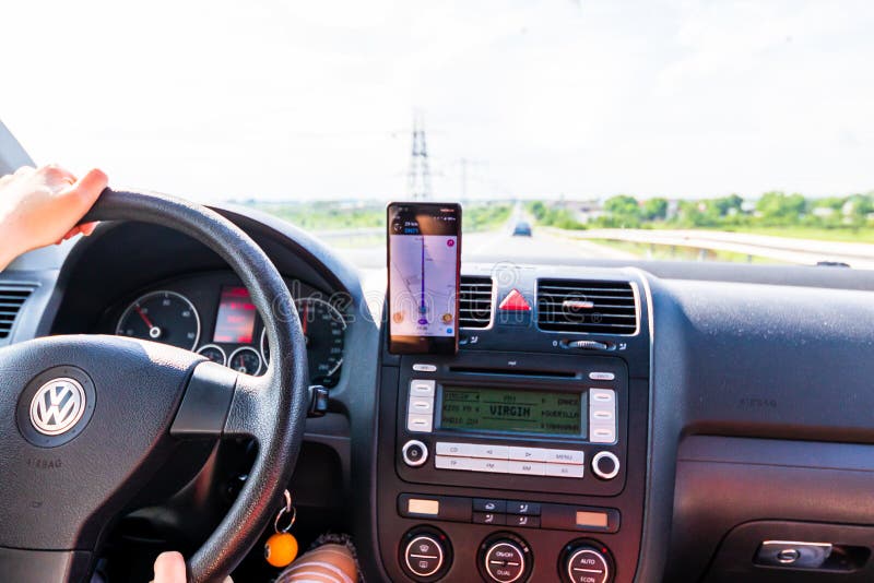 Using Waze Maps Application on Smartphone on Car Dashboard, Bucharest ...