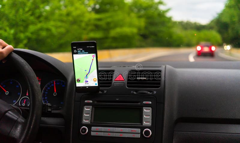 Using Waze Maps Application on Smartphone on Car Dashboard, Bucharest ...
