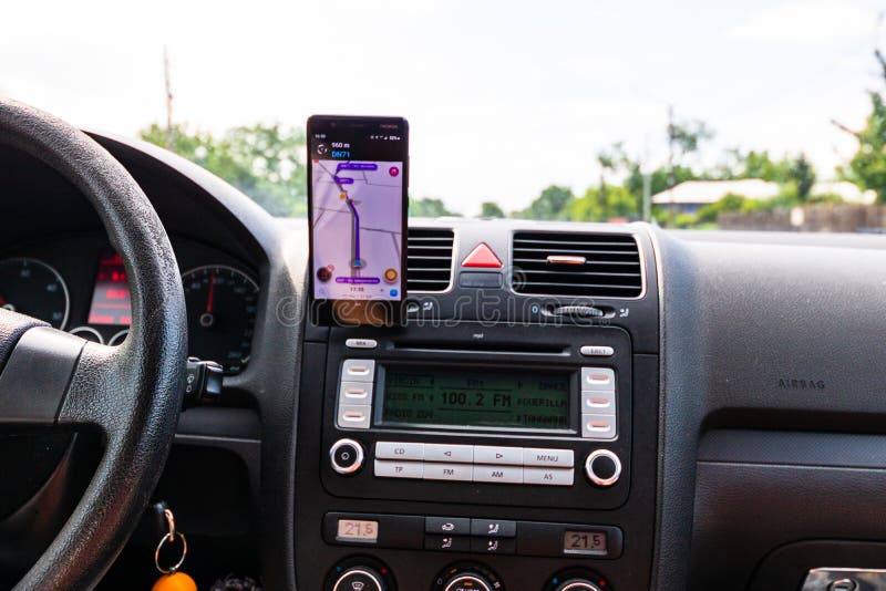 Using Waze Maps Application on Smartphone on Car Dashboard, Bucharest ...
