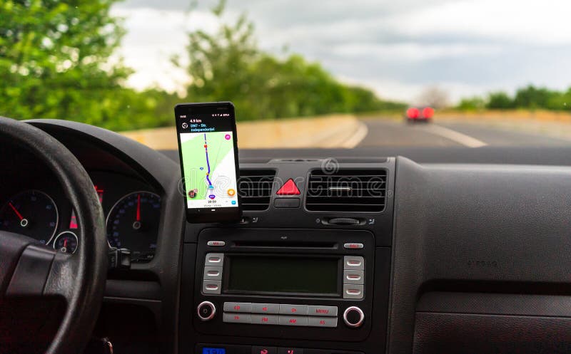 Using Waze Maps Application on Smartphone on Car Dashboard, Bucharest ...