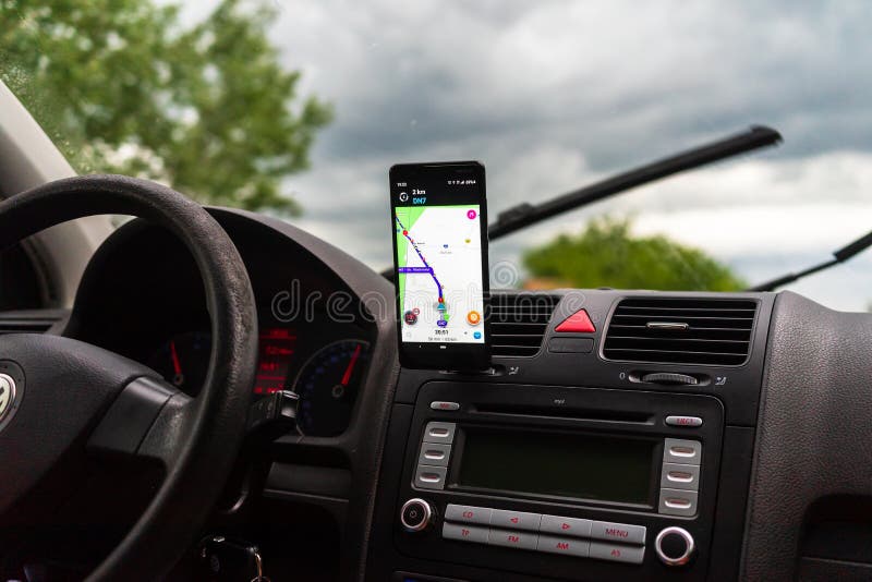 Using Waze Maps Application on Smartphone on Car Dashboard, Bucharest ...