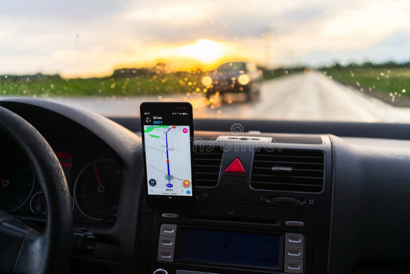 Using Waze Maps Application on Smartphone on Car Dashboard, Driver ...