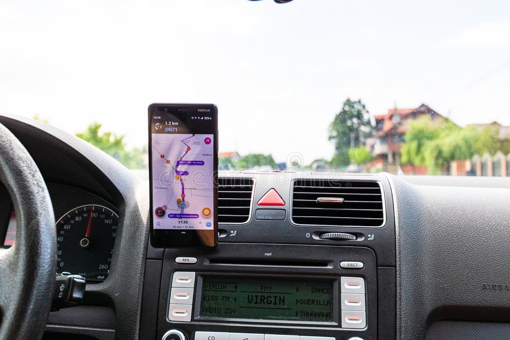 Using Waze Maps Application on Smartphone on Car Dashboard, Driver ...