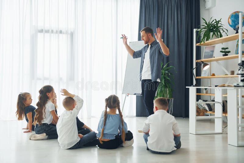 Using Whiteboard. Group of Children Students in Class at School with ...