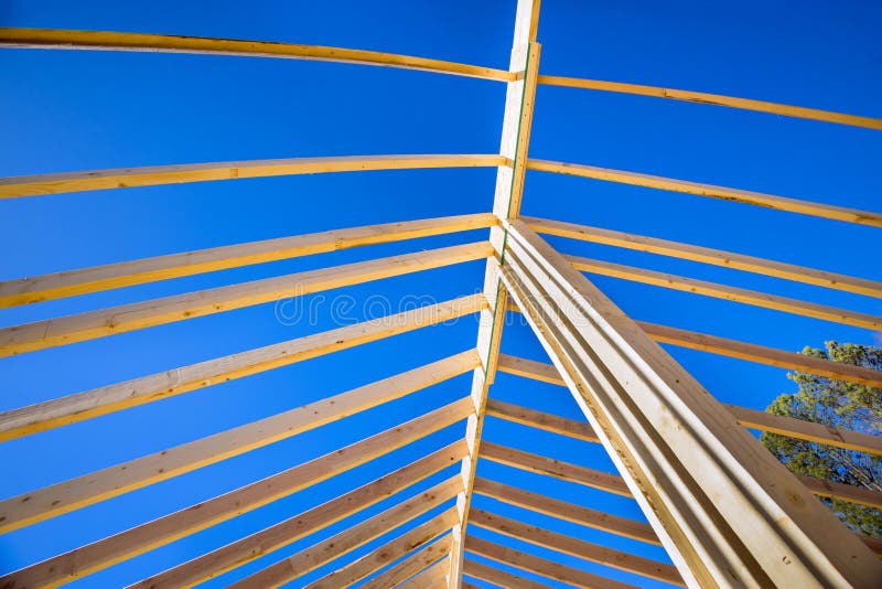 Using Wood Frame Trusses For Roof Construction On A New House Is Method That Uses Support Beams