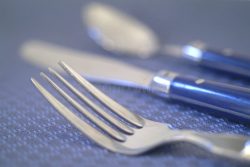 Utensils on a table cloth stock photo. Image of restaurant - 5564548