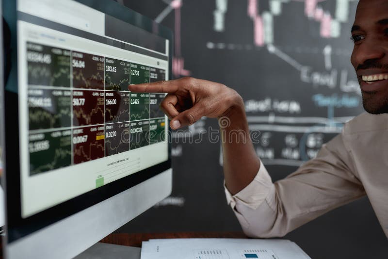 Utilising Skills for Earnings. African Businessman, Trader Sitting in ...