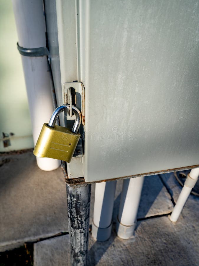 Utility Box with a Gold-colored Padlock Stock Photo - Image of caldwell ...