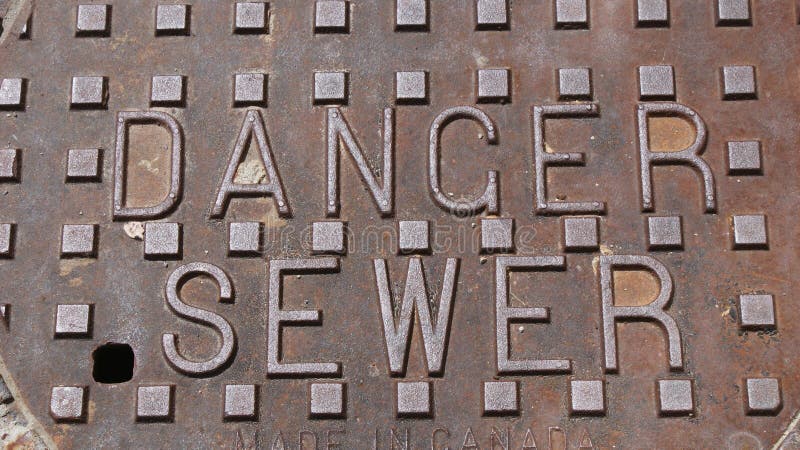 Utility hole cover closeup editorial stock image. Illustration of ...