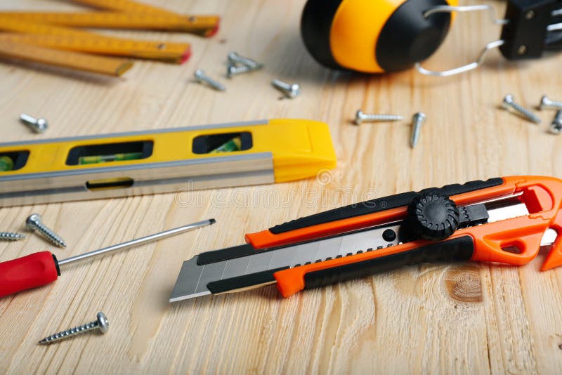 Utility Knife and Different Tools on Wooden Table Stock Photo - Image ...