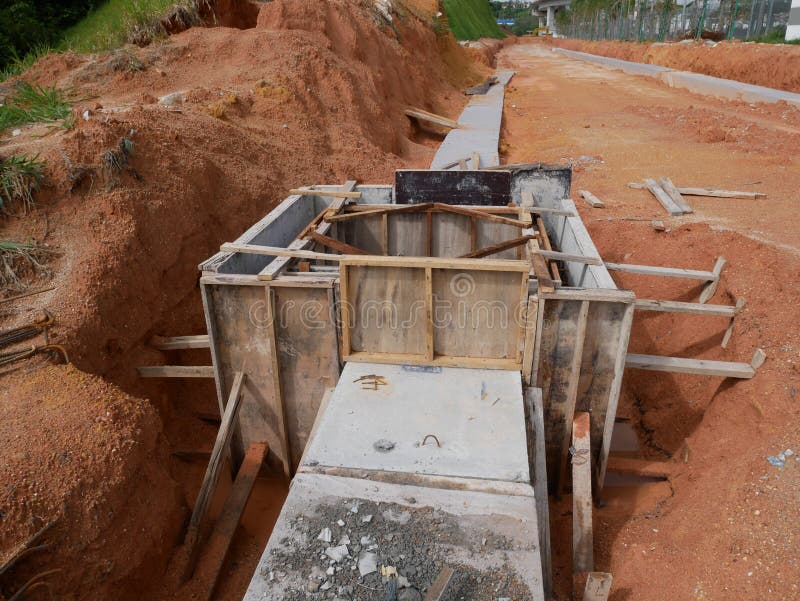 Utility Manhole Under Construction at a Construction Site. Editorial ...