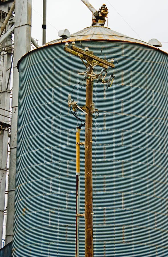 Utility Pole and Storage Silo Stock Photo - Image of industry, brown ...