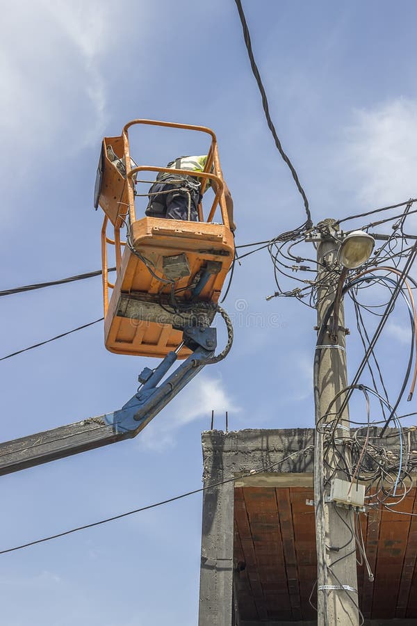 Utility Pole Worker Replacing Cables on an Electric Pole 2 Stock Photo ...