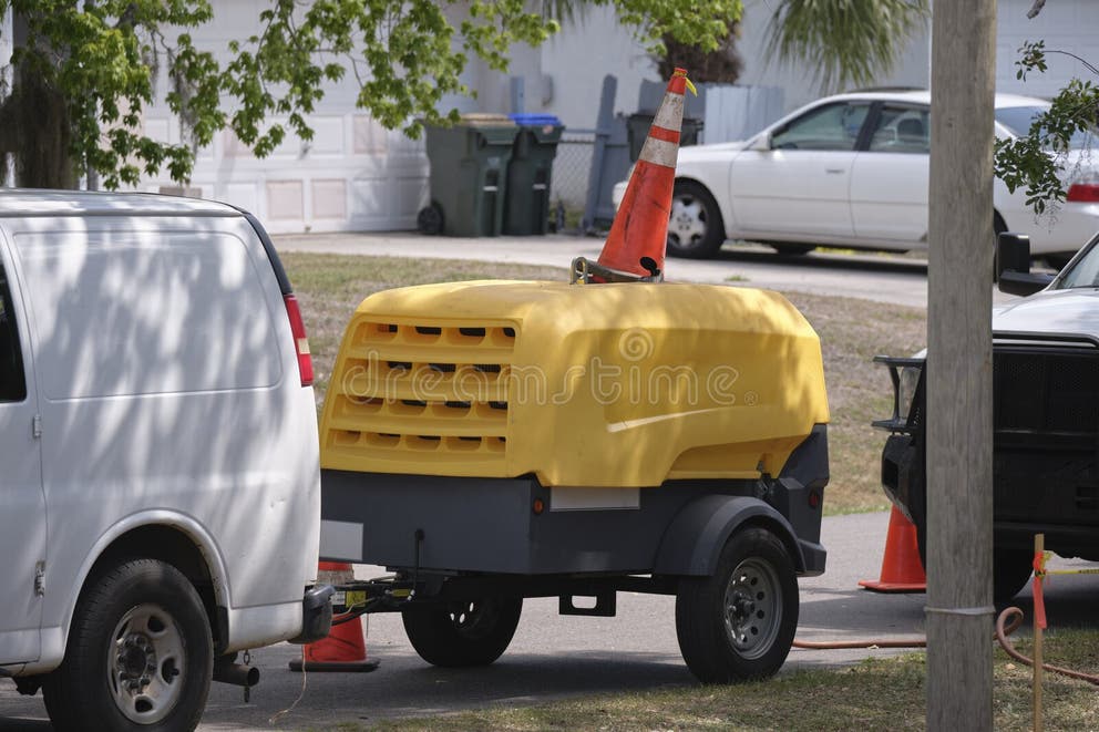 Utility Van with Yellow Compressor Trailer with Jackhammer Machine on ...