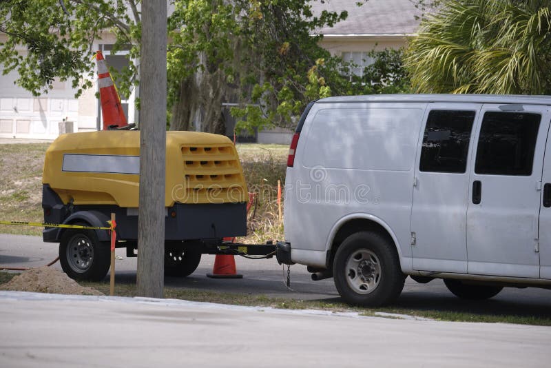 Utility Van with Yellow Compressor Trailer with Jackhammer Machine on ...