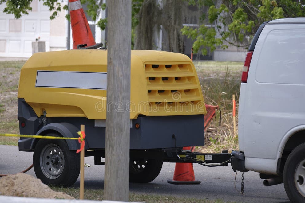 Utility Van with Yellow Compressor Trailer with Jackhammer Machine on ...