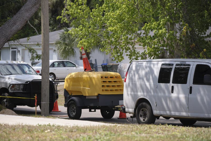 Utility Van with Yellow Compressor Trailer with Jackhammer Machine on ...