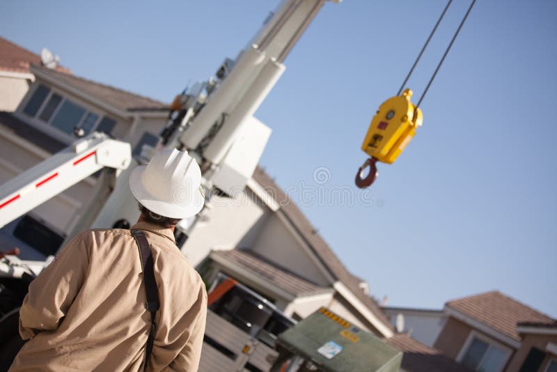 Utility Worker Navigating Remote Crane Stock Image - Image of button ...