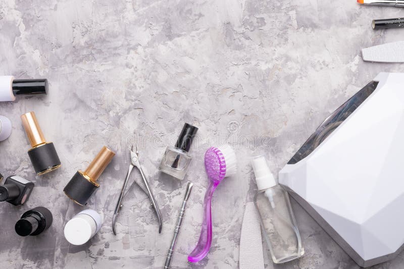 UV Manicure Nail Care Tools. on Concrete Texture with Space Stock Photo ...