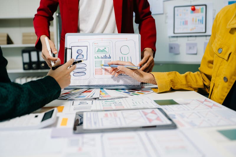 Ux Developer And Ui Designer Brainstorming About Mobile App Interface Wireframe Design With