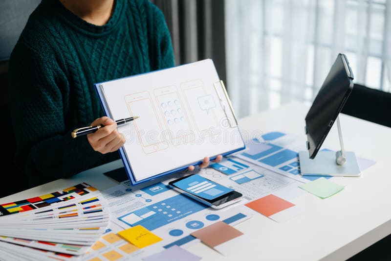 Ux Developer And Ui Designer Brainstorming About Mobile App Interface Wireframe Design With