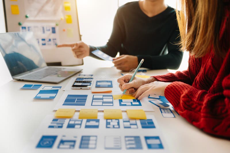 UX Developer and Ui Designer Brainstorming about Mobile App Interface ...