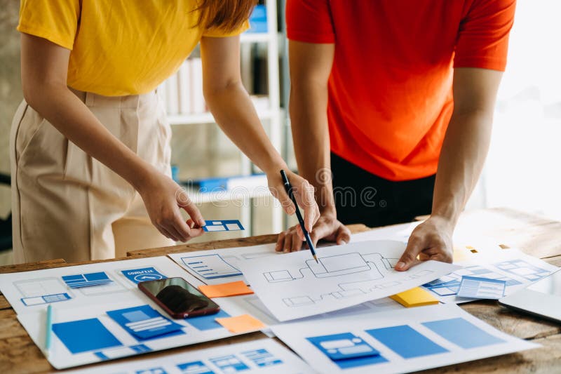 Ux Developer And Ui Designer Brainstorming About Mobile App Interface