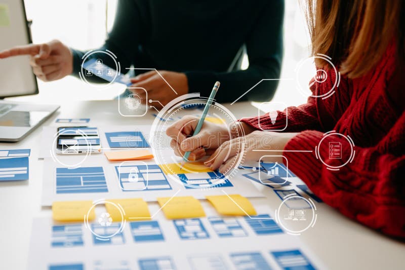 Ux Developer And Ui Designer Brainstorming About Mobile App Interface Wireframe Design With