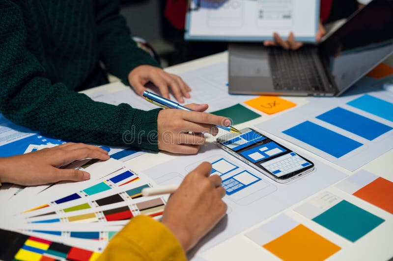Ux Developer And Ui Designer Brainstorming About Mobile App Interface Wireframe Design With