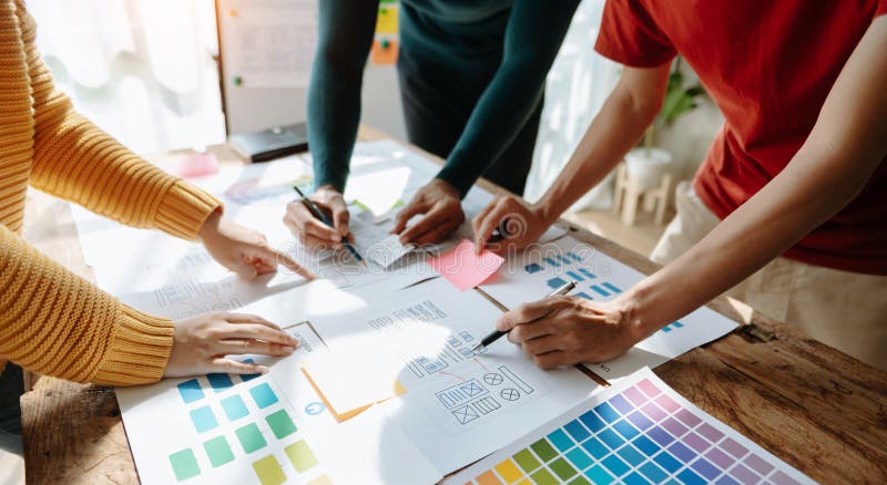 Ux Developer And Ui Designer Brainstorming About Mobile App Interface Wireframe Design With