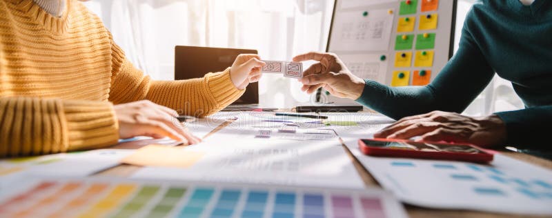 Ux Developer And Ui Designer Brainstorming About Mobile App Interface