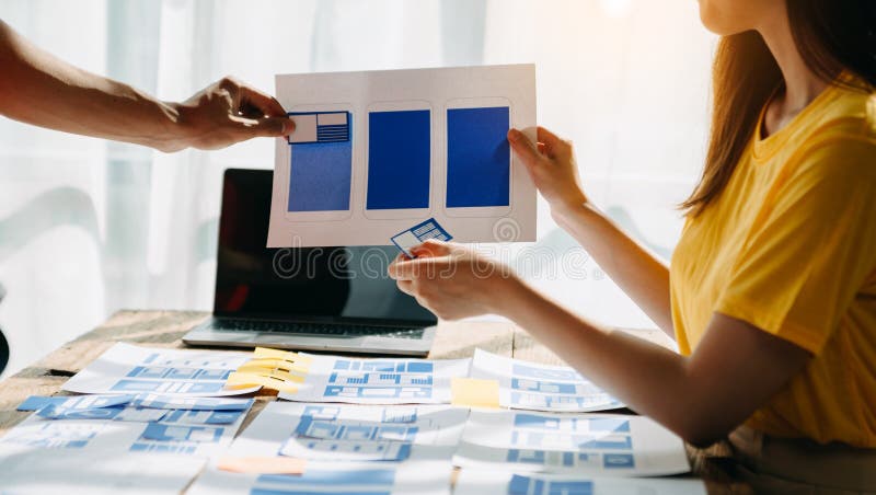 Ux Developer And Ui Designer Brainstorming About Mobile App Interface