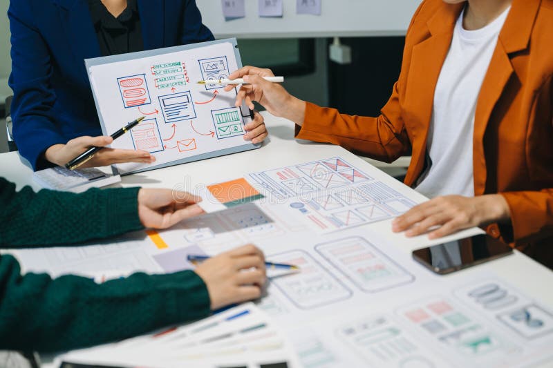 Ux Developer And Ui Designer Brainstorming About Mobile App Interface Wireframe Design Stock