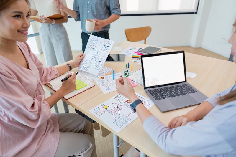 Ux Developer And Ui Designer Presenting And Testing Mobile App