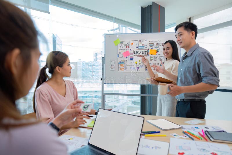 Ux Developers and Ui Designers Listening To Mobile App Presentations in ...