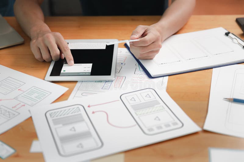 UX or UI Designers Designing on Their Smartphone Application Layout ...