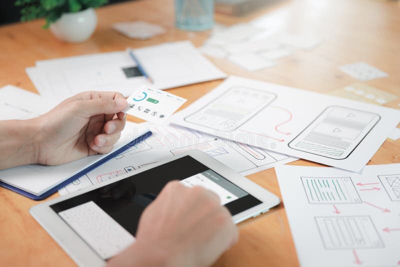 UX or UI Designers Designing on Their Smartphone Application Layout ...