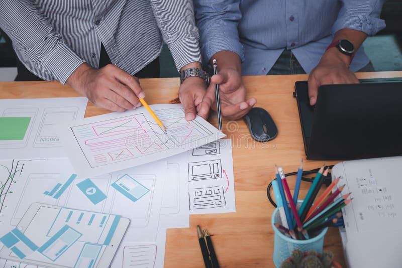 UX or UI Designers Designing on Their Smartphone Application Layout ...