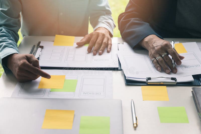 UX or UI Designers Designing on Their Smartphone Application Layout ...