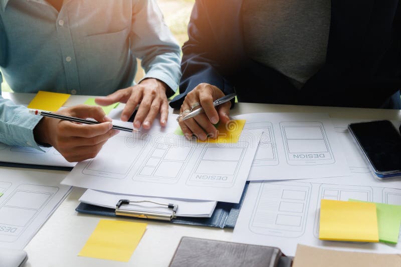 UX or UI Designers Designing on Their Smartphone Application Layout ...