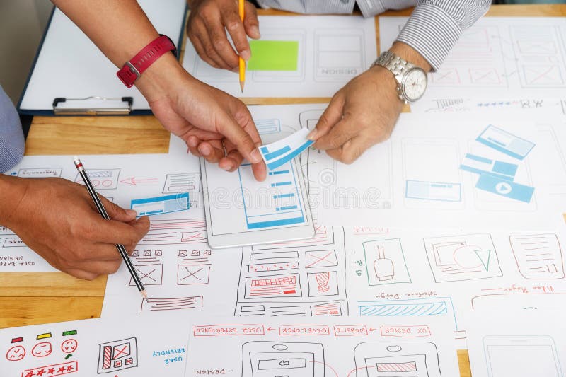 UX or UI Designers Designing on Their Smartphone Application Layout ...