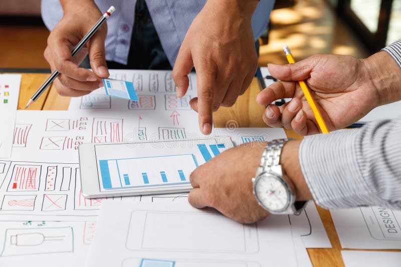 UX or UI Designers Designing on Their Smartphone Application Layout ...