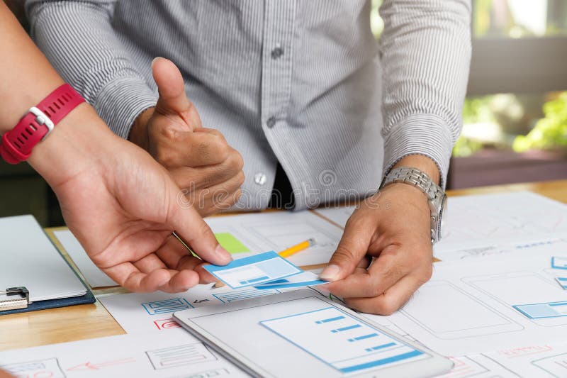 UX or UI Designers Designing on Their Smartphone Application Layout ...