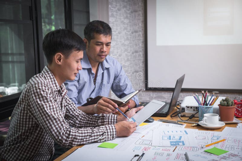 UX or UI Designers Designing on Their Smartphone Application Layout ...