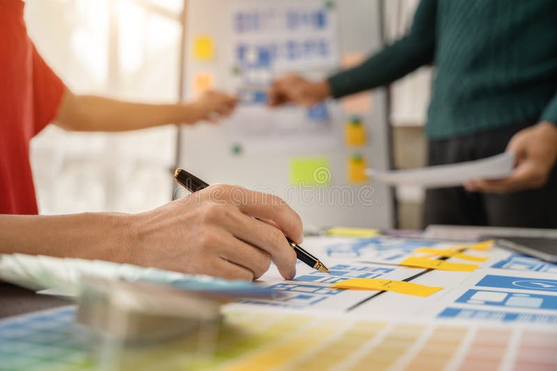 Ux Ui Developer And Ui Designer Brainstorming About Mobile App Interface Wireframe Design With