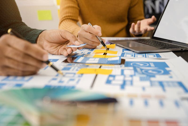 Ux Ui Developer And Ui Designer Brainstorming About Mobile App Interface Wireframe Design With