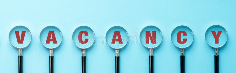 Vacancy Inscription on a Magnifying Glass on a Blue Background. Stock ...