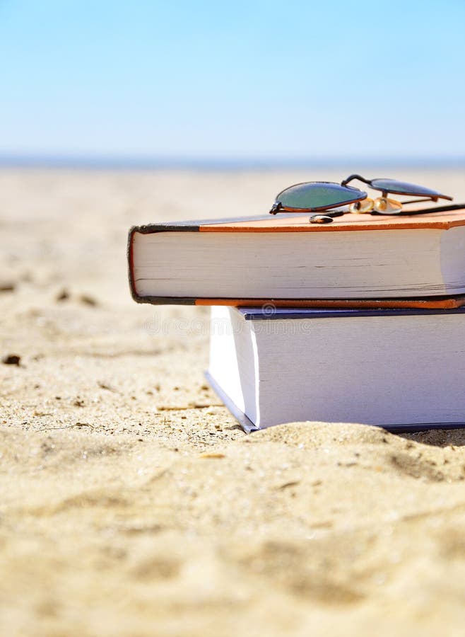 Vacation Beach With Books In Sand Stock Photo - Image of leisure ...