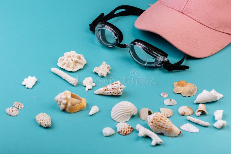Vacation Concept: Cap, Swimming Goggles, Different Kinds of Seashells ...