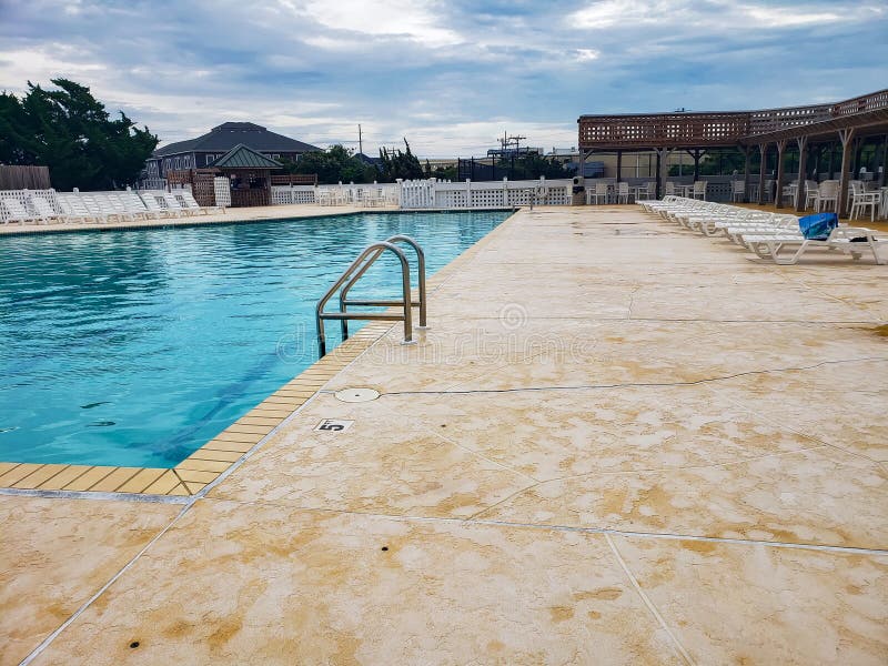 Vacation Pool Area with Clean Water and Seating Stock Image - Image of ...